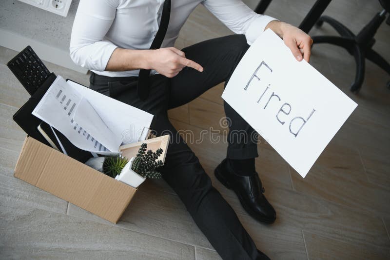 Fired Employee Holding Fired Sign in Hand Stock Photo - Image of ...