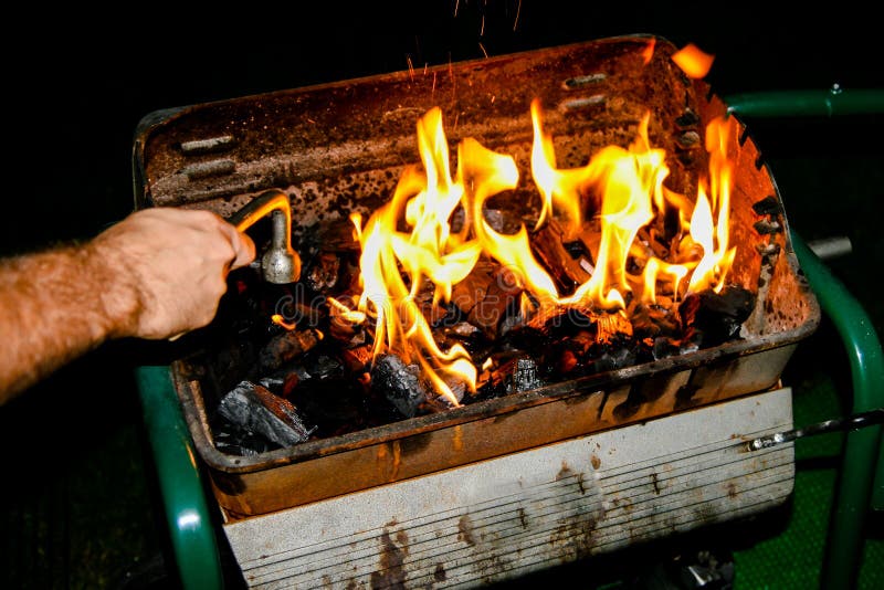 Fired up the grill stock image. Image of cooking, fiery - 46217355