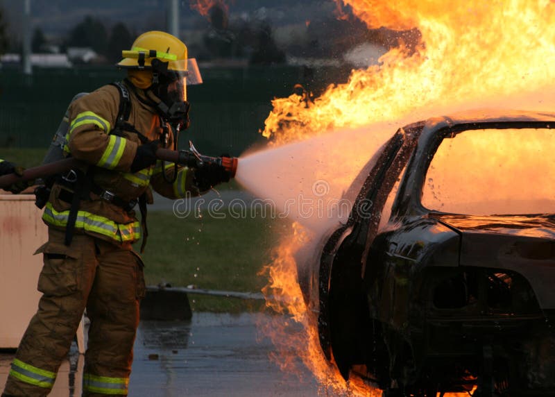 Fireman at car fire stock image. Image of professional - 28163507