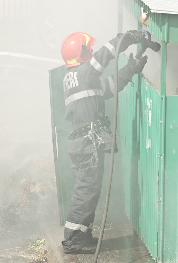 Firefighter in action stock image. Image of enforcement - 42172693