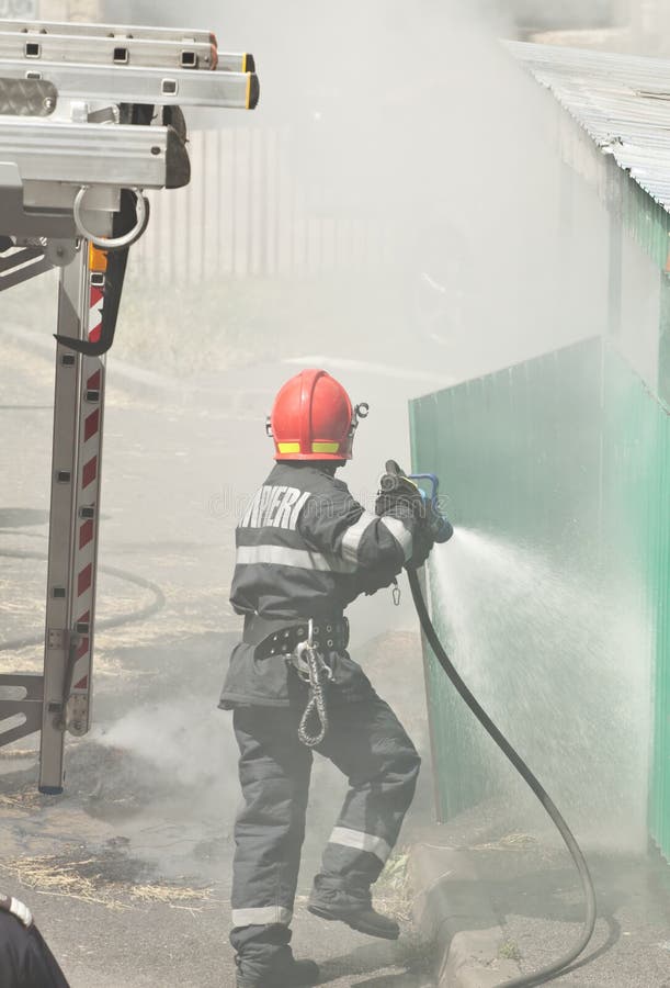 Firefighter in action stock image. Image of helmet, occupation - 42172701