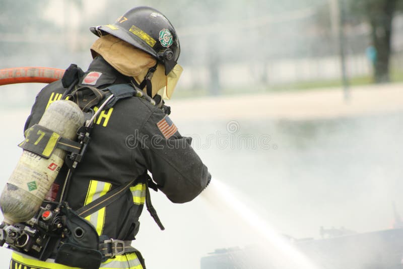 Firefighter in action editorial stock image. Image of uniform - 88138489