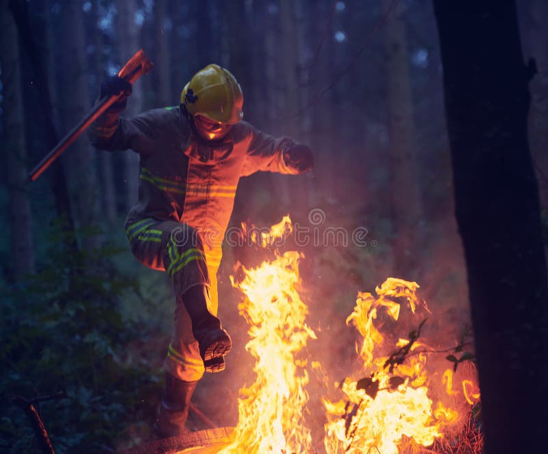 Firefighter in action stock image. Image of fighter - 192981703