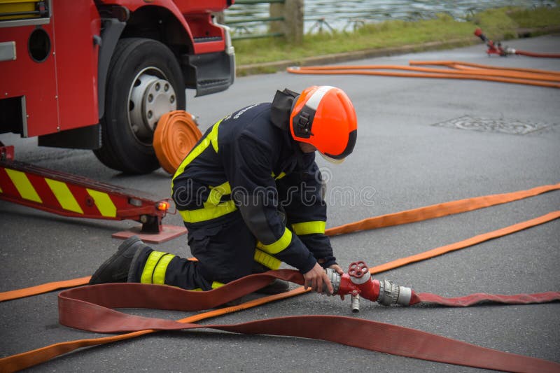 Firefighter in Action during a Training Editorial Photo - Image of ...