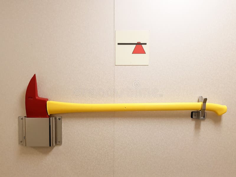 Firefighter Axe and a Sign on a Wall in a Building Stock Image - Image ...