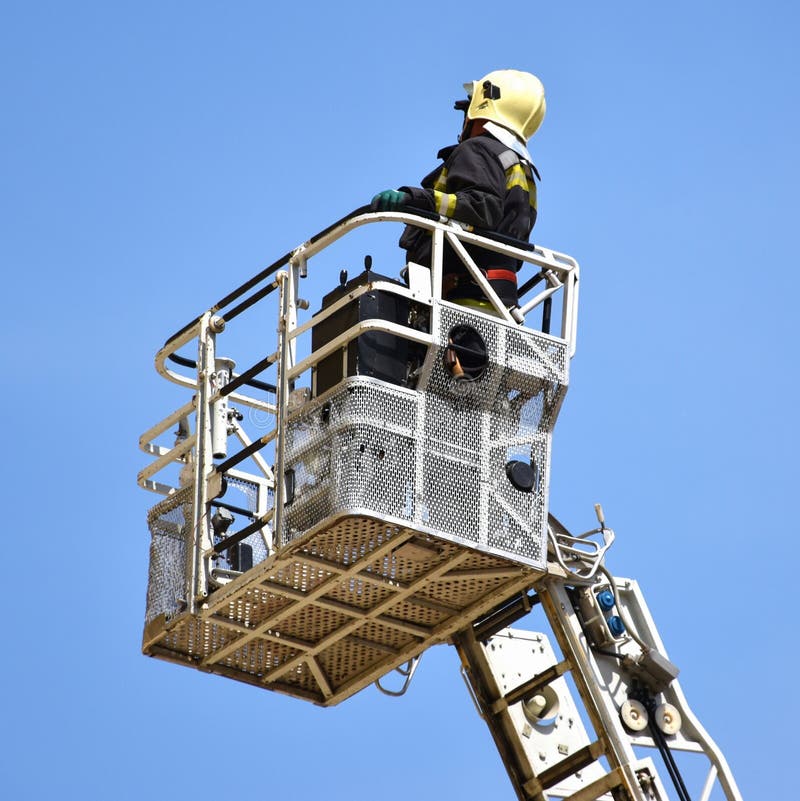 Firefighter in the Basket of a Ladder Stock Photo - Image of lift ...
