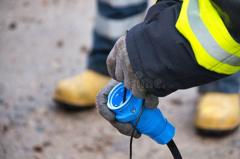A Firefighter Checks the Protective Conductor Function on a Power Line ...