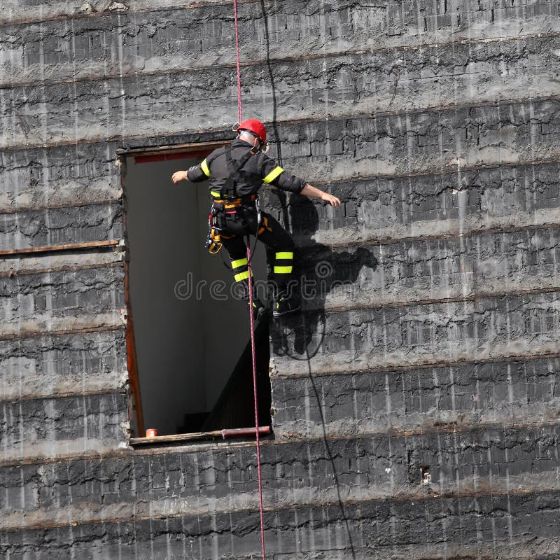 Fireman Climbing Expert during the Ascent Abseiling from a Build ...