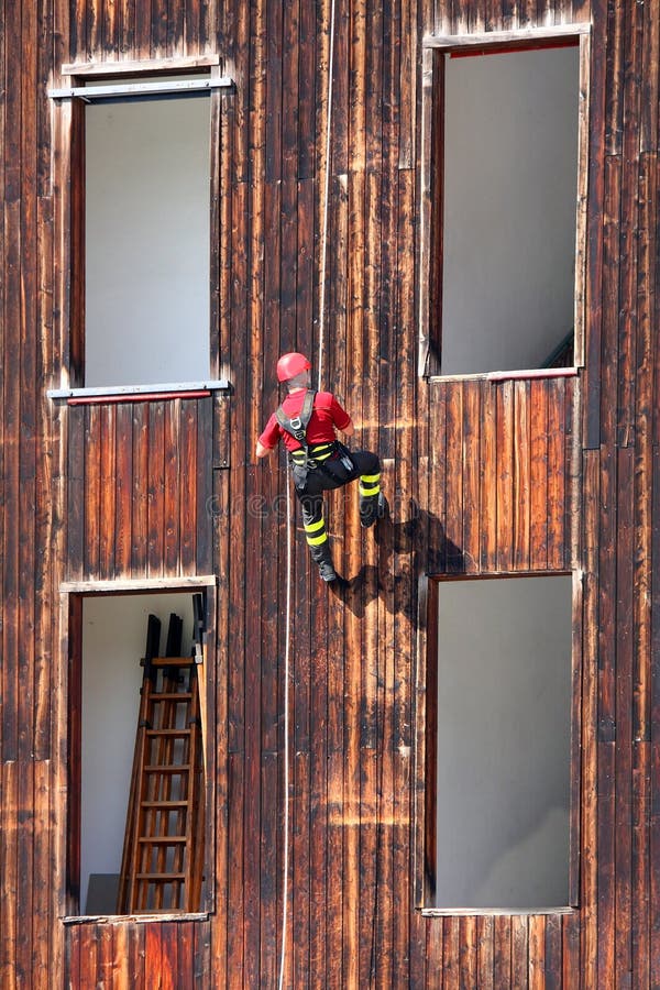 Firefighter Climbs the Building with Four Windows during Fire Drill ...