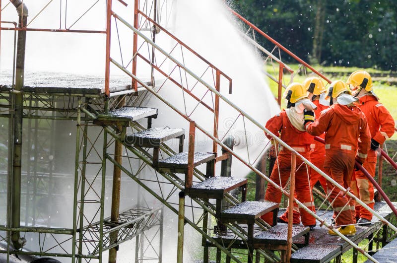 Firefighter Concept. Fireman Using Water and Extinguisher To Fighting ...