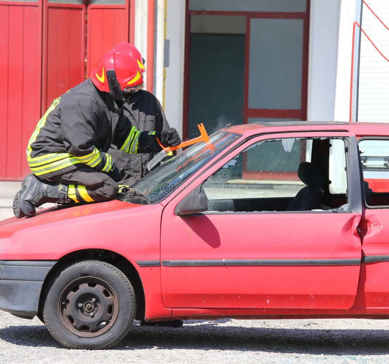Firefighter Cuts the Windshield of Car with a Hacksaw Stock Image ...