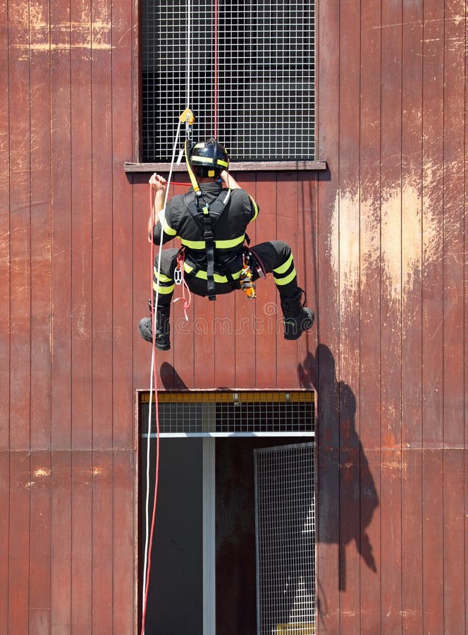 Firefighter Descending from a Building Using the Double Rope Technique ...