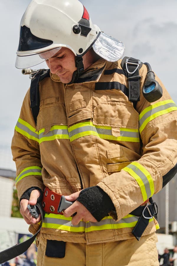 A Firefighter Dons the Essential Components of Their Professional Gear ...