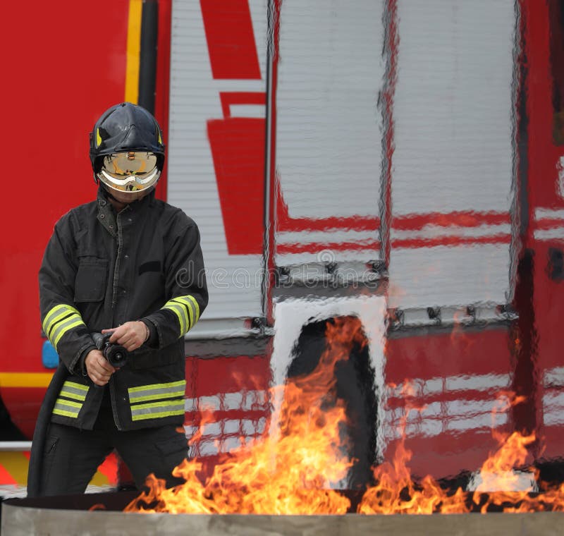 Firefighter Drill with Hot Fire Flames To Put Out Stock Photo - Image ...