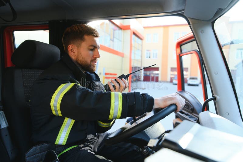 Firefighter Drives a Emergency Vehicle with Communication Interior View ...