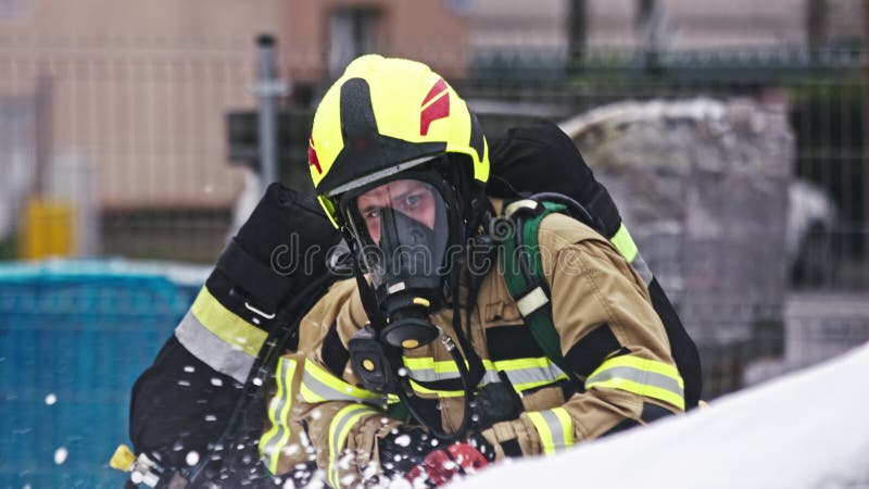 Firefighter Extinguish Fire in House Using Spraying Hose Stock Footage ...