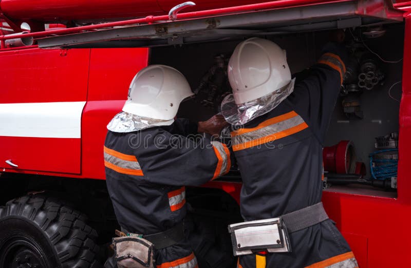 Firefighter Extinguishes the Fire with Smoke Stock Image - Image of ...