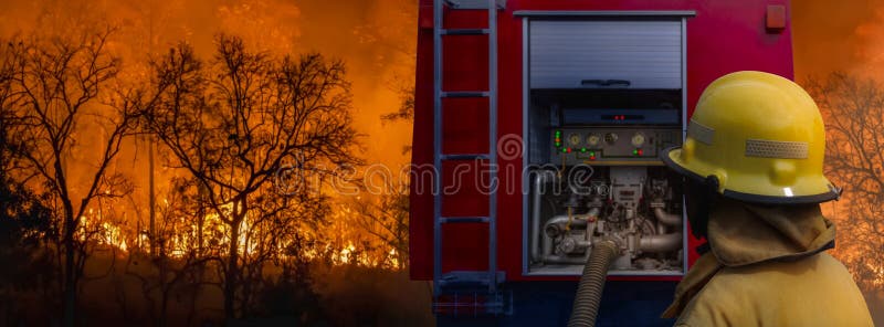 Firefighter Extinguishing Wildfire with Fire Truck Stock Image - Image ...