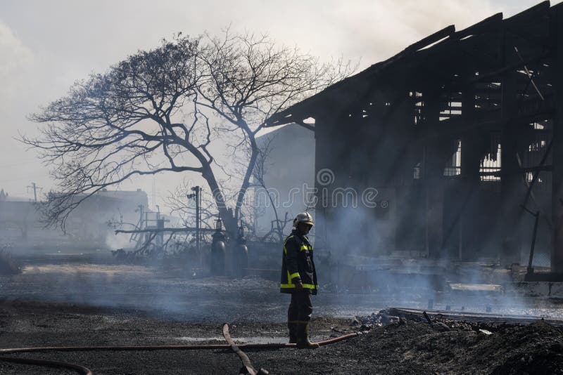 Firefighter Facing a Large-scale Fire at the Supertanker Base in ...