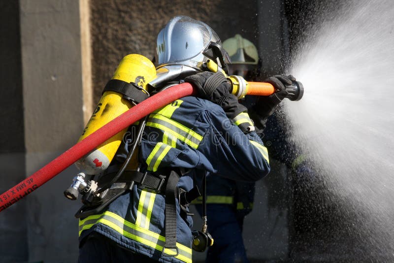 Firefighter Fighting for a Fire Attack, during a Training Exercise ...