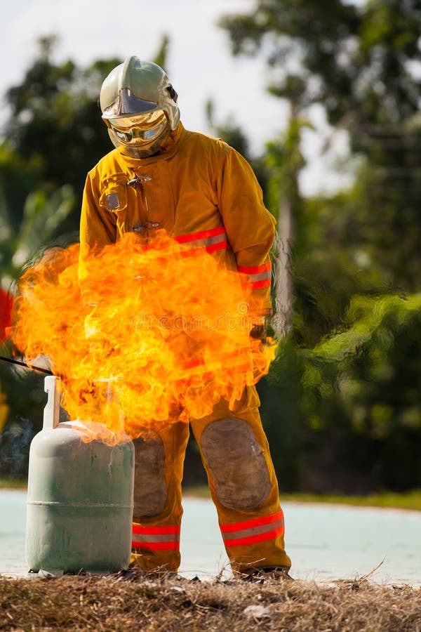 Firefighter With Fire And Suit For Protect Fire Fighter For Training ...