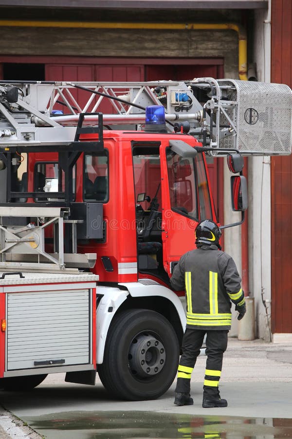 Firefighter and Fire Truck during a Firefighting Exercise Stock Photo ...