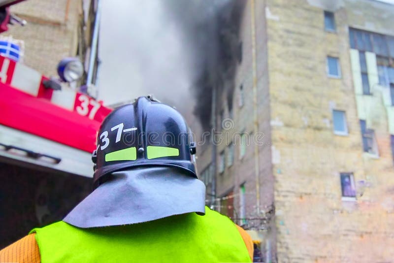 Firefighter in Front of a Fire in a High-rise Trade Building, Fighting ...