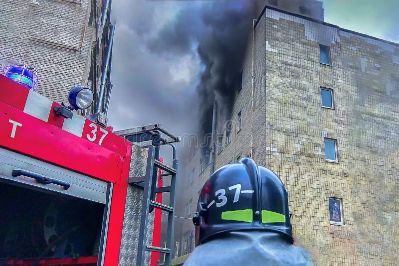 Firefighter in Front of a Fire in a High-rise Trade Building, Fighting ...