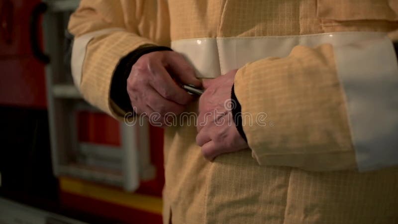 Firefighter Going on Call. Clip. Close-up of Firefighter Getting Ready ...