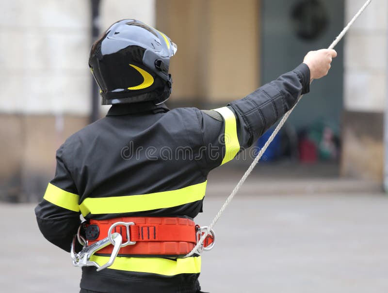 Firefighter with Hardhat during Rescue Operations with a Rope Editorial ...