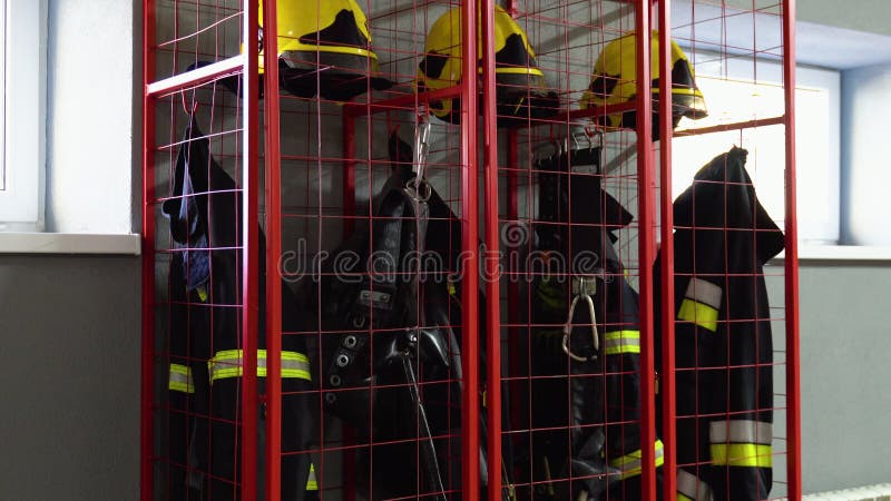 Firefighter Helmets and Protection Coats Hanging in the Fire Station ...