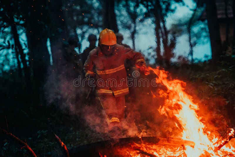 Firefighter Hero in Action Danger Jumping Over Fire Flame To Rescue and ...