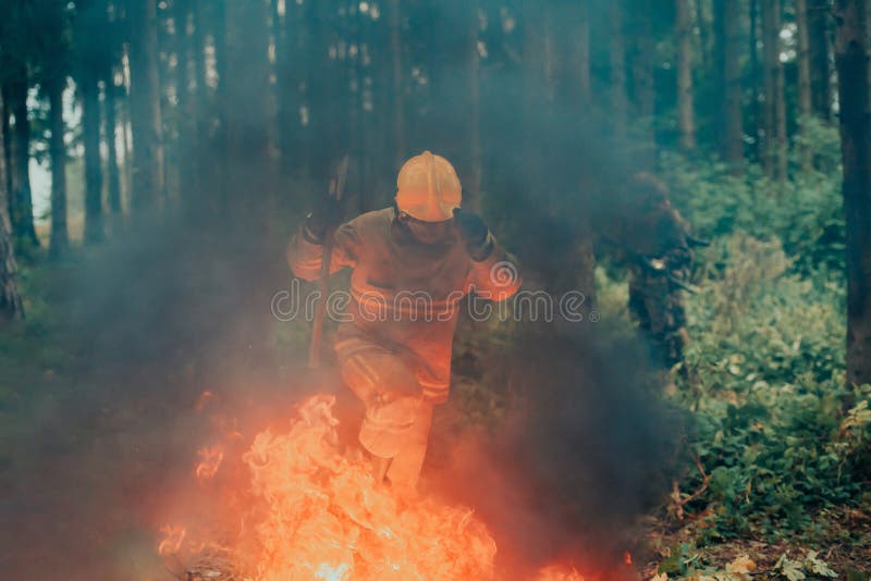 Firefighter Hero in Action Danger Jumping Over Fire Flame To Rescue and ...