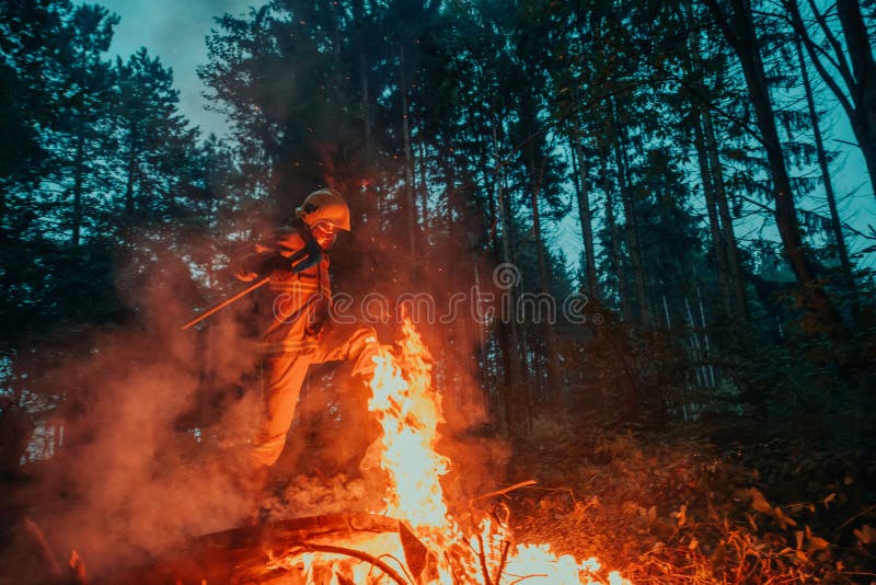 Firefighter Hero in Action Danger Jumping Over Fire Flame To Rescue and ...