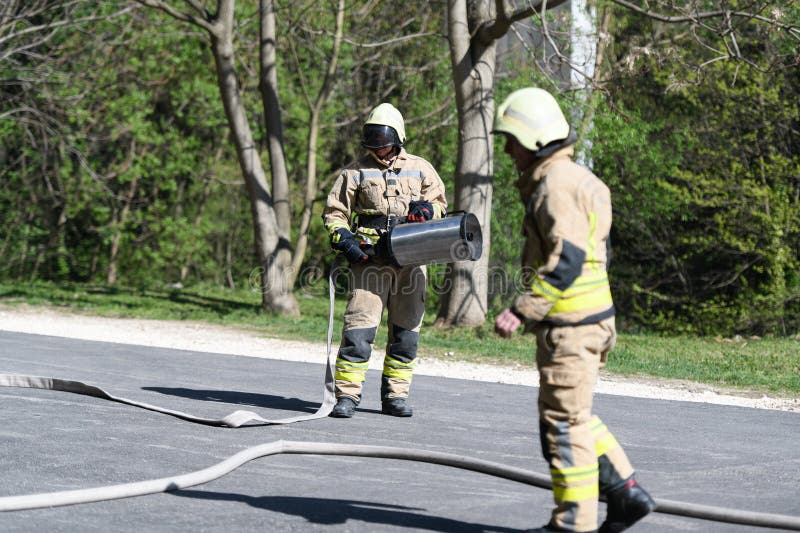 Professional Firefighter Preparing Foam Device for Action Editorial ...
