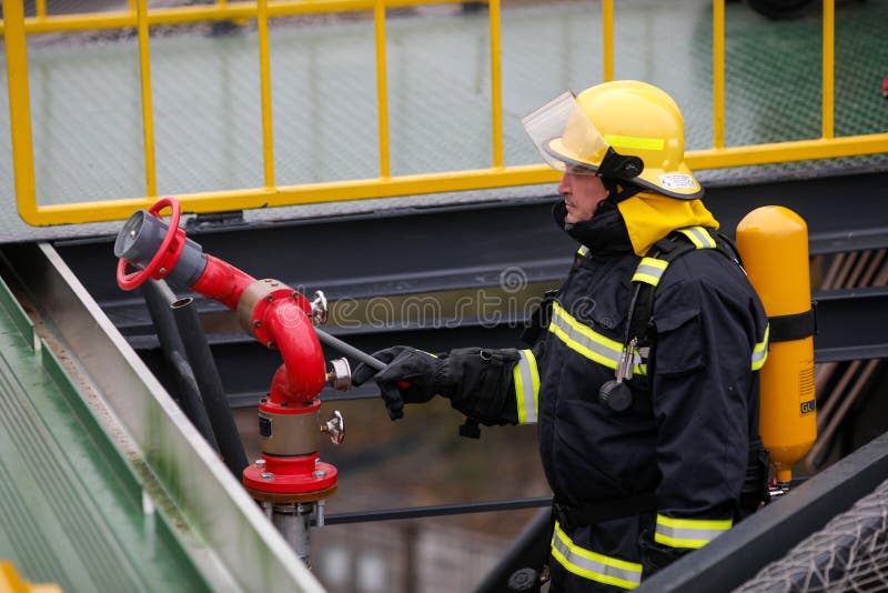 Firefighter Holds a Fire Suppression System Hydrant on a Hospital ...