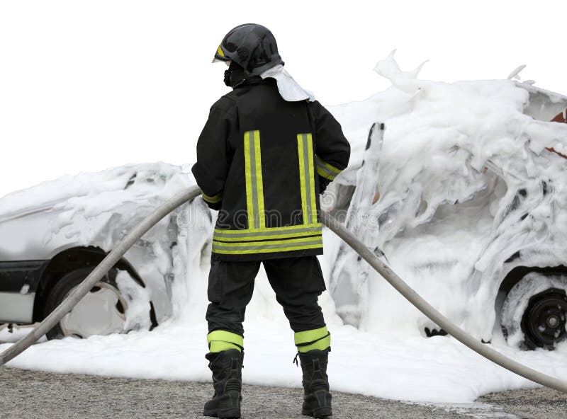 Firefighter with Hose while Extinguishing the Fire of the Wrecke Stock ...