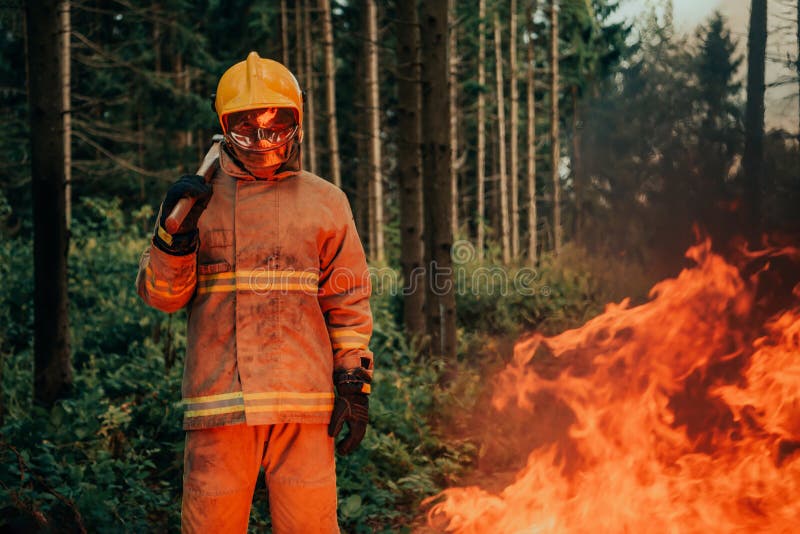 Firefighter at Job. Firefighter in Dangerous Forest Areas Surrounded by ...