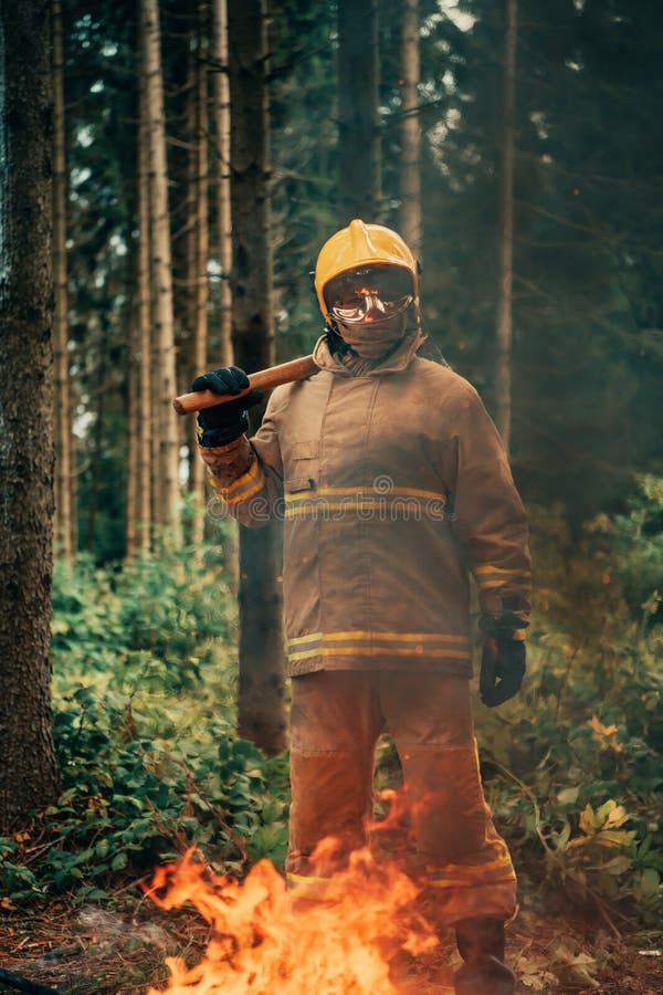 Firefighter at Job. Firefighter in Dangerous Forest Areas Surrounded by ...