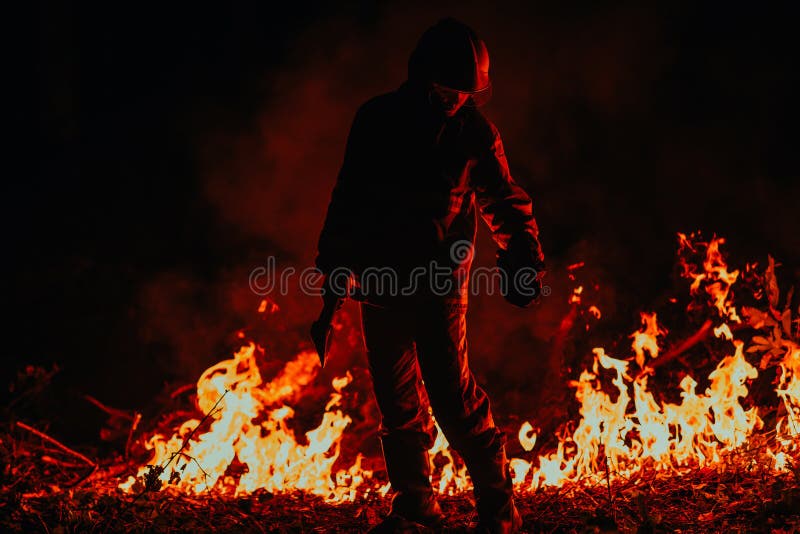 Firefighter at Job. Firefighter in Dangerous Forest Areas Surrounded by ...