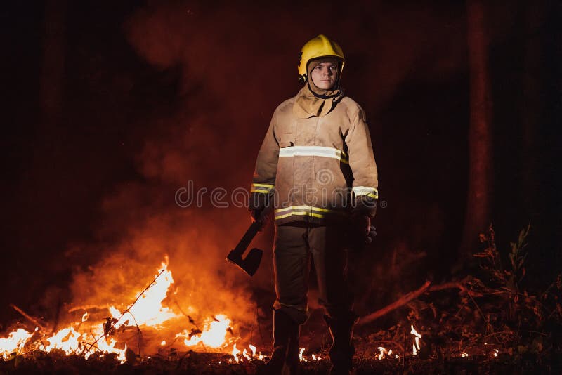 Firefighter at Job. Firefighter in Dangerous Forest Areas Surrounded by ...