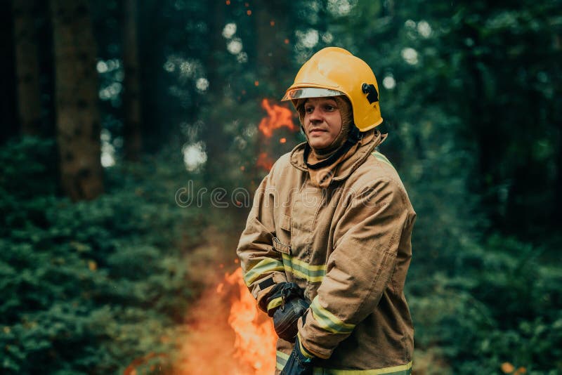 Firefighter at Job. Firefighter in Dangerous Forest Areas Surrounded by ...