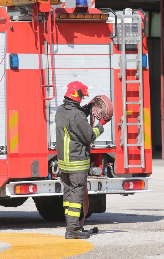 Firefighter Lifted the Hose after Switching Off the Fire Stock Image ...