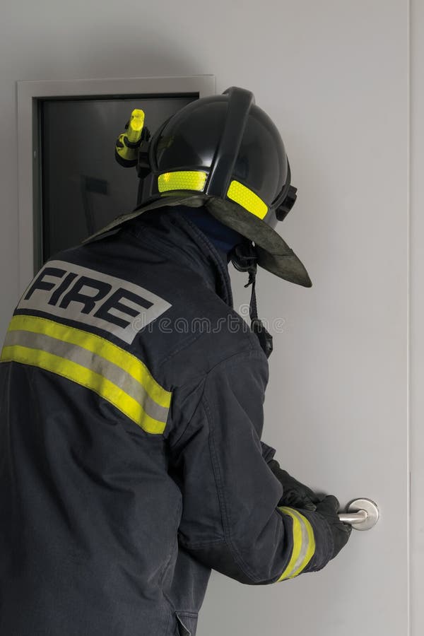 Firefighter Looking Away while Using Walkie Talkie Stock Photo - Image ...