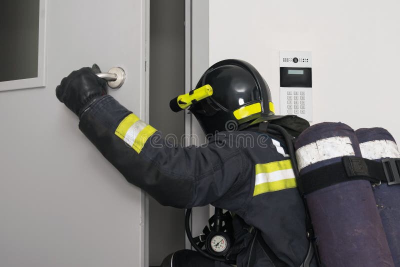 Firefighter Looking Away while Using Walkie Talkie Stock Photo - Image ...
