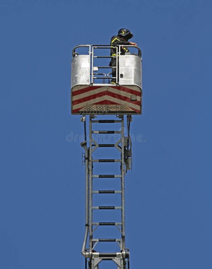 Firefighter Over the Staircase on the Metallic Basket Stock Image ...