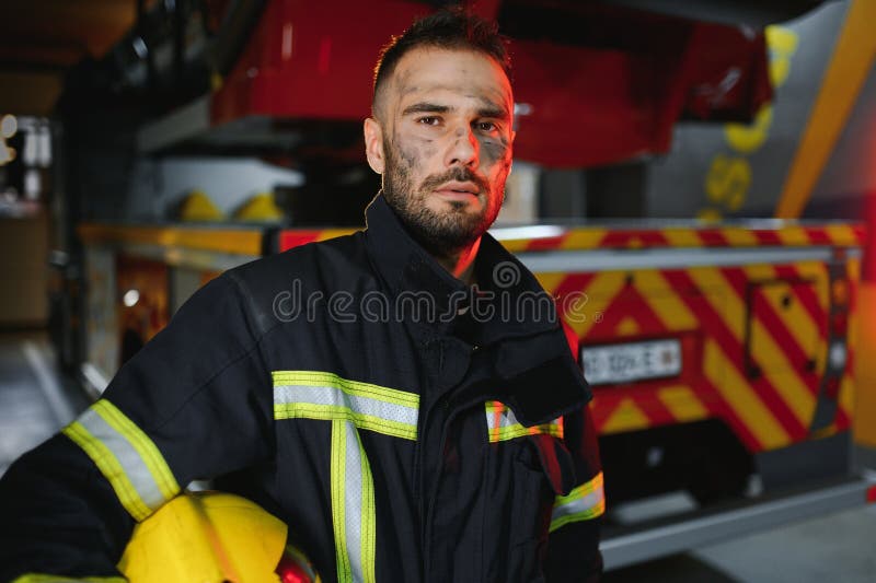 Firefighter Portrait on Duty. Fireman with Helmet Near Fire Engine ...