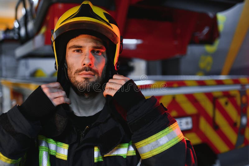 Firefighter Portrait on Duty. Fireman with Helmet Near Fire Engine ...