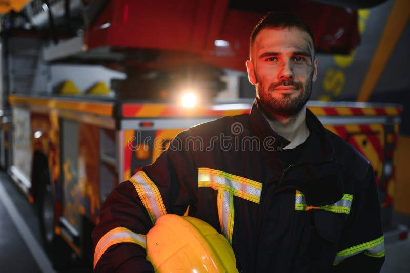 Firefighter Portrait on Duty. Fireman with Helmet Near Fire Engine ...