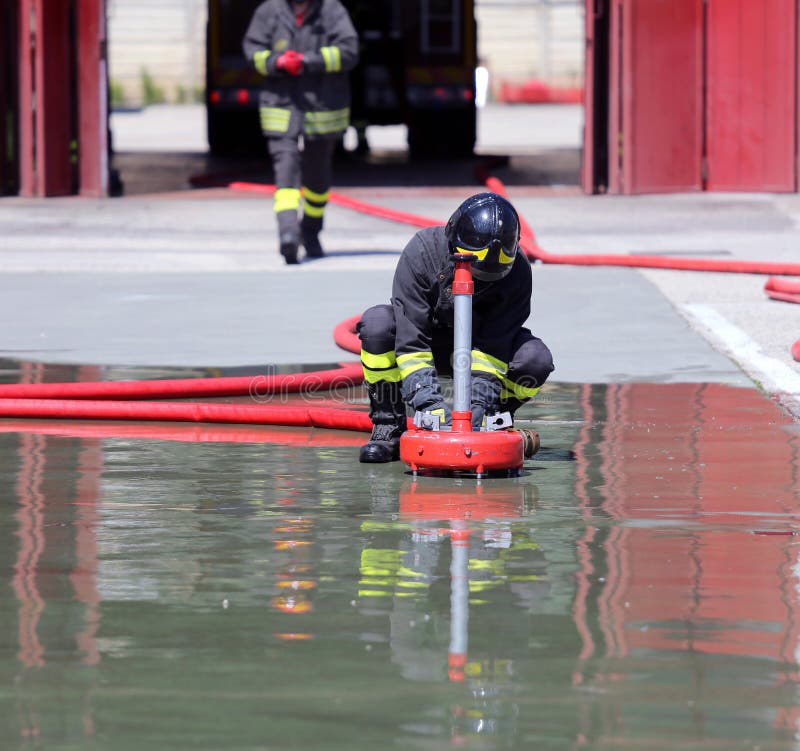 Firefighter Positions a Powerful Fire Hydrant during the Exercises ...